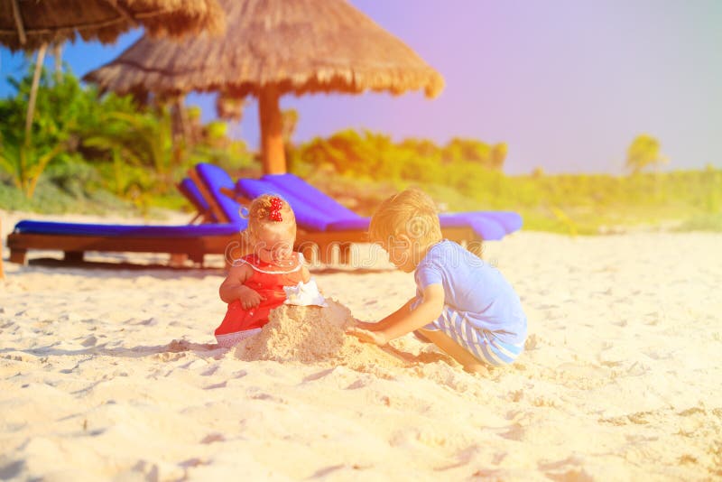 Kids Playing with Sand on Beach Stock Photo - Image of little, cheerful ...