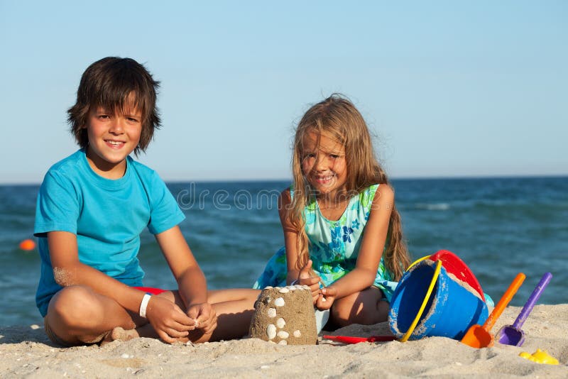 Kids playing in the sand stock image. Image of cheerful - 39722755