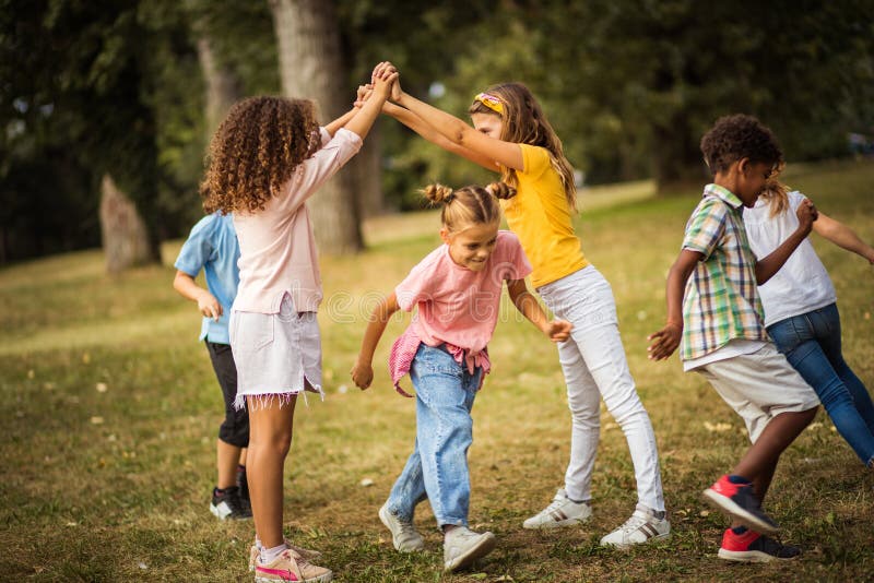Kids playing in schoolyard stock image. Image of boys - 215219489