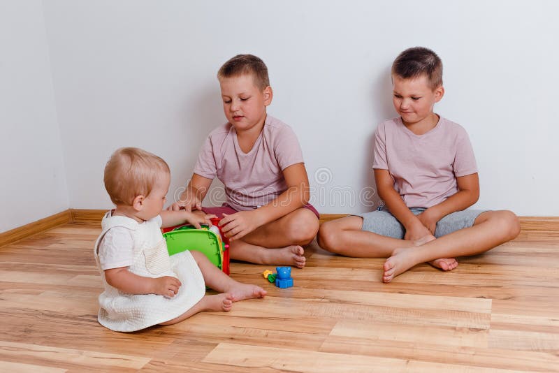 Kids Playing Sitting on the Floor Stock Photo - Image of lying, child ...