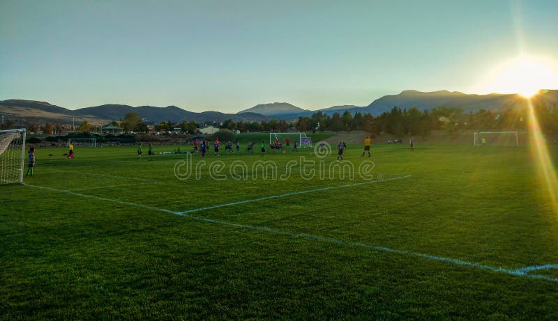 Kids playing soccer editorial photography. Image of green - 60782562
