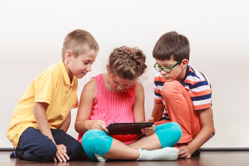 Kids playing on tablet. stock image. Image of childhood - 60781011