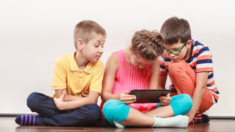 Kids playing on tablet. stock image. Image of boys, comfortable - 76429143