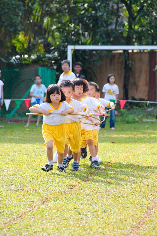 Kids Playing Teamwork Racing Editorial Stock Image - Image of green ...