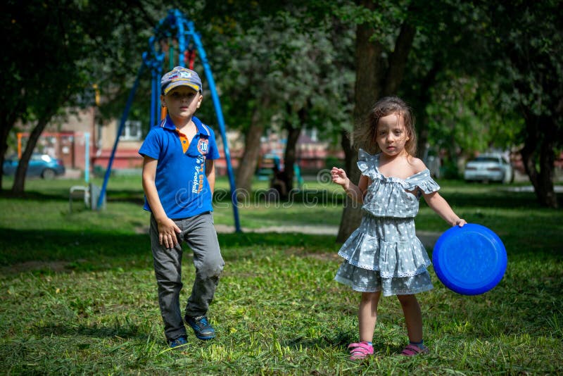 Kids Plays Tossing a Flying Disc Stock Image - Image of game ...