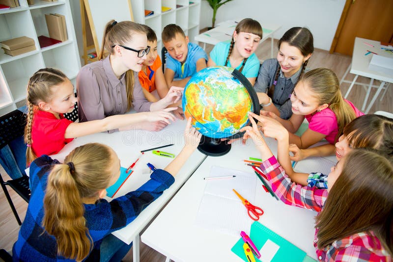 Kids pointing at globe stock image. Image of girl, happy - 89647629