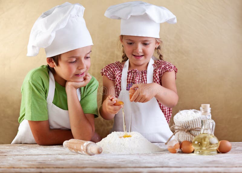 Kids preparing a cake stock image. Image of girl, breaking - 25543523
