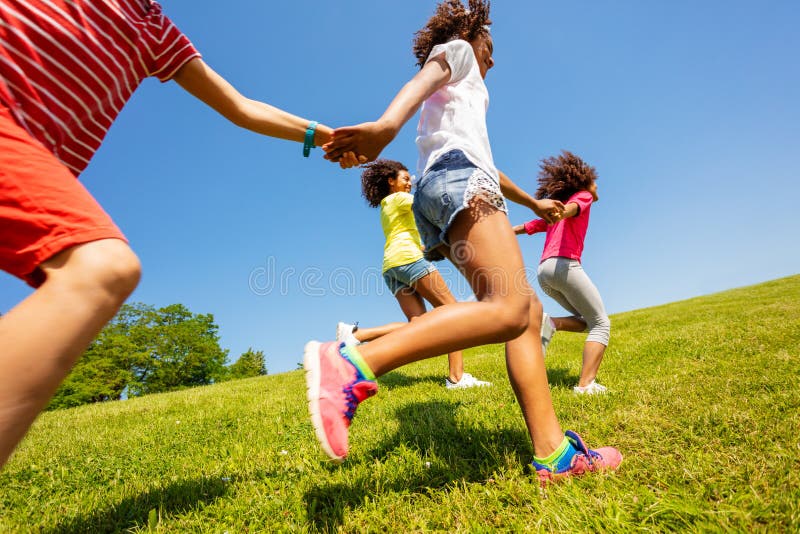 Kids in Profile Run and Pull Hands of Each Other Stock Image - Image of ...