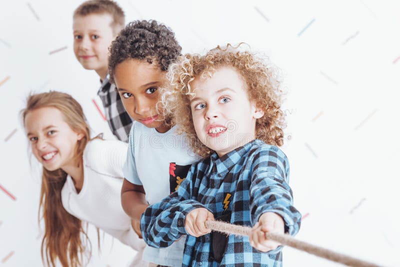 Kids pulling a rope stock photo. Image of cute, brothers - 103946294