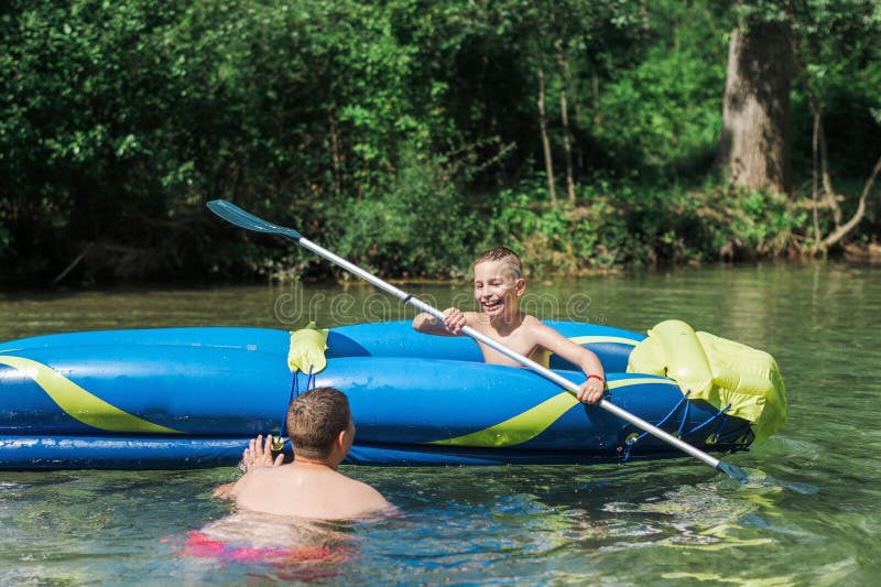 Kids Rafting on the River during a Summer Day. Stock Image - Image of ...