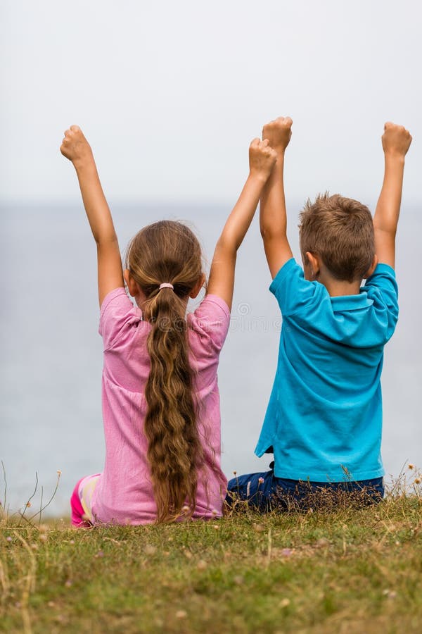 Kids with raised arms stock photo. Image of gesturing - 46046148