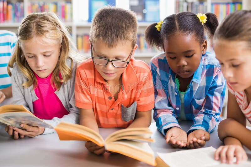 Kids Reading a Book in Library Stock Image - Image of book, holding ...