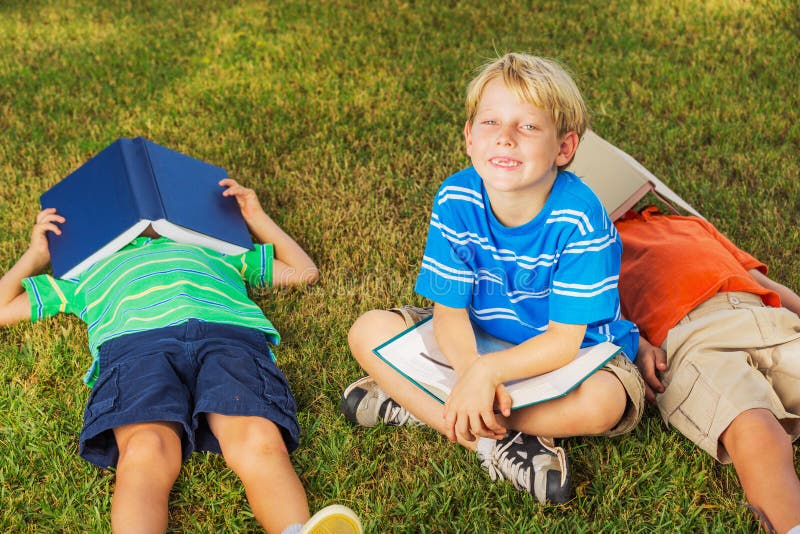 Kids Reading Books stock image. Image of lying, hobby - 33587685