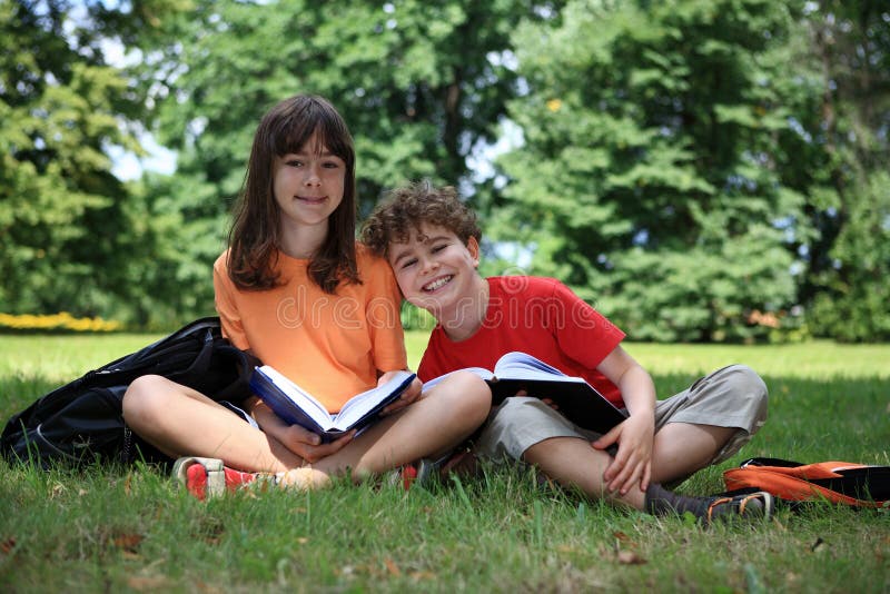 Kids reading books outdoor stock image. Image of outdoor - 6010215