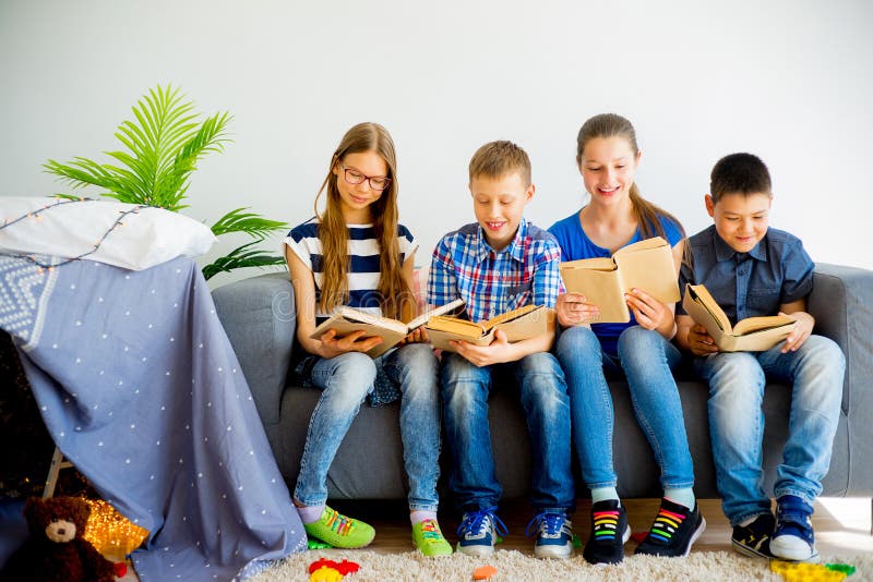 Kids reading books stock image. Image of couch, lying - 97172261
