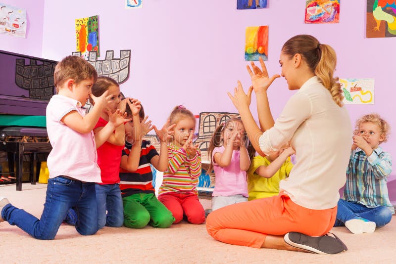 Kids Repeat Gesture in Classroom after Teacher Stock Image - Image of ...