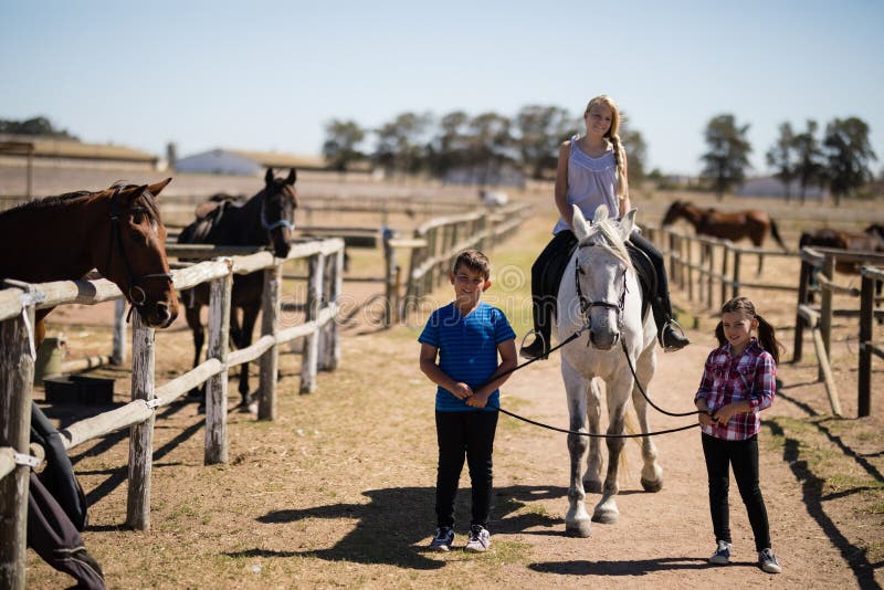 Kids Walking with a White Horse in the Ranch Stock Photo - Image of ...