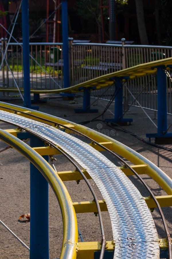 Kids Roller Coaster Yellow Rails in Amusement Park. Stock Image - Image ...