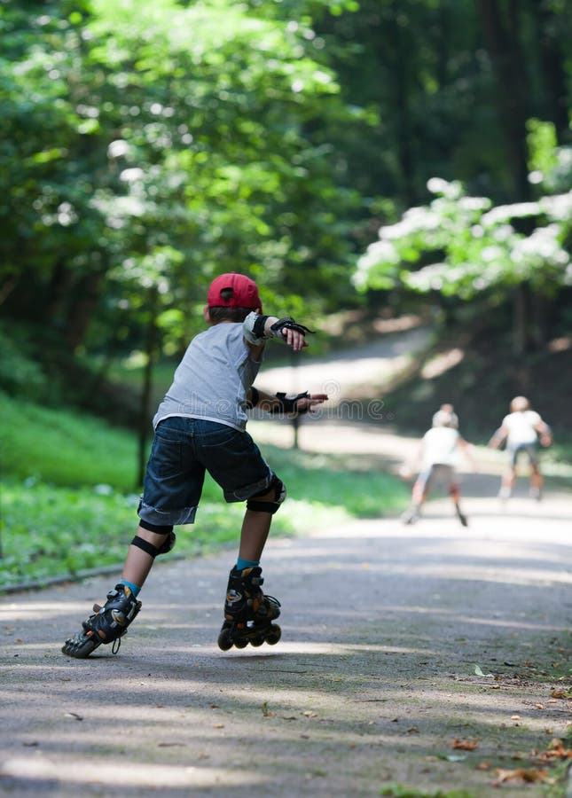 Boys Rollerblading stock photo. Image of grin, happiness - 4821046