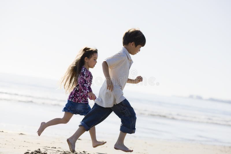 Boy Running on Beach Walkway Stock Photo - Image of tween, horizontal ...