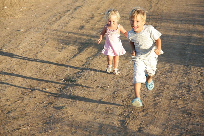 Kids Running by Country Road Stock Photo - Image of lovely, portrait ...