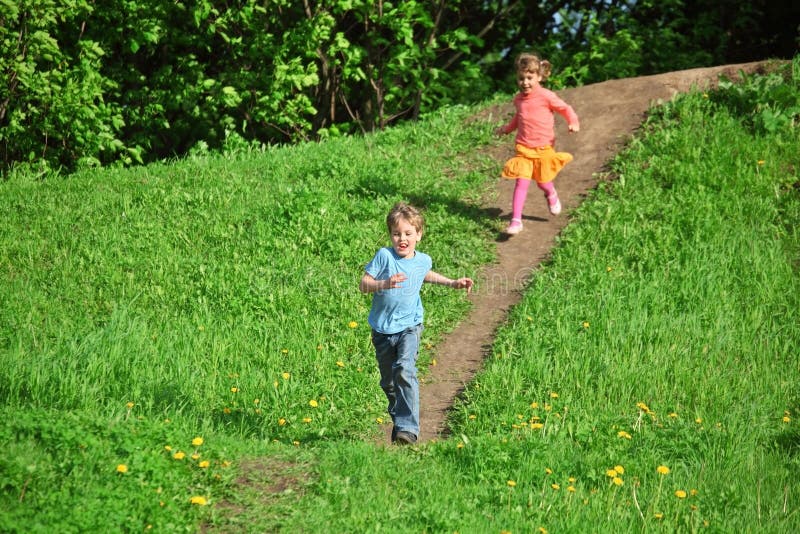 Kids running down the hill stock image. Image of lifestyle - 10969473