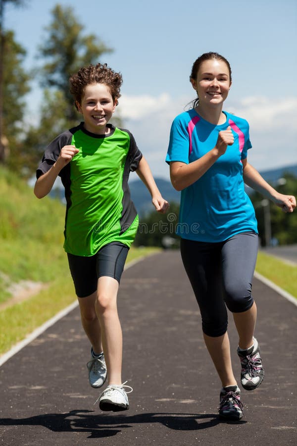 Mother with Kids Running in Park Stock Image - Image of energy, action ...
