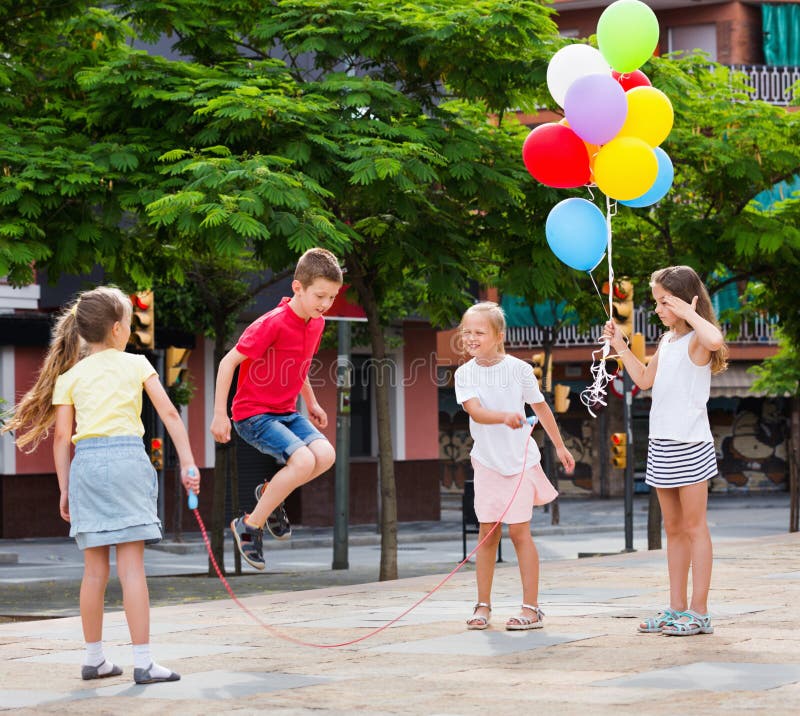 Kids in School Age Playing Together with Jumping Rope Stock Image ...