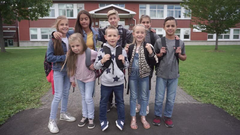 Group of Kids on the School Background Having Fun Stock Footage - Video ...