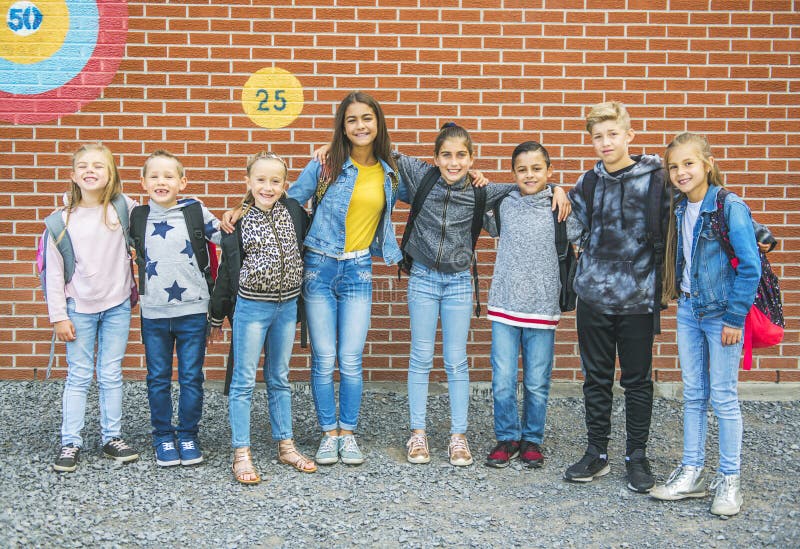 Group of Kids on the School Background Having Fun Stock Photo - Image ...