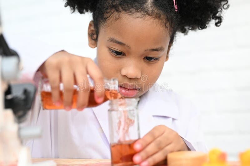Kids with Science Lab Coat Studying and Learning in Science at School ... Kids with Science Lab Coat Studying and Learning in Science at School ...