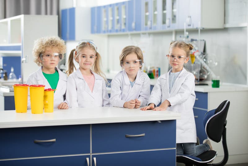 Kids in Science Laboratory Wearing Coats and Standing at Table Stock ...