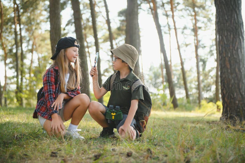 Kids scouts in the forest. stock photo. Image of nature - 255418778