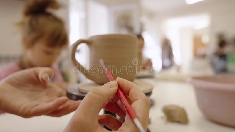 Children Enjoy Pottery Class at a Creative Studio in a Vibrant Setting ...