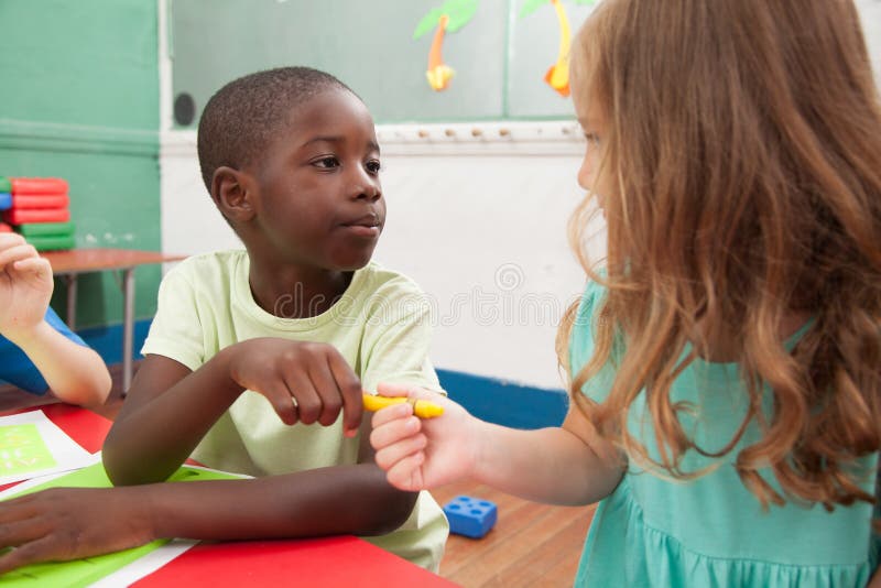 Kids sharing one pencil stock photo. Image of girl, classroom - 66718648