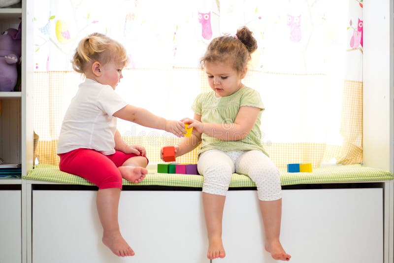 Kids Sisters Play Together Indoors Stock Image - Image of activity ...