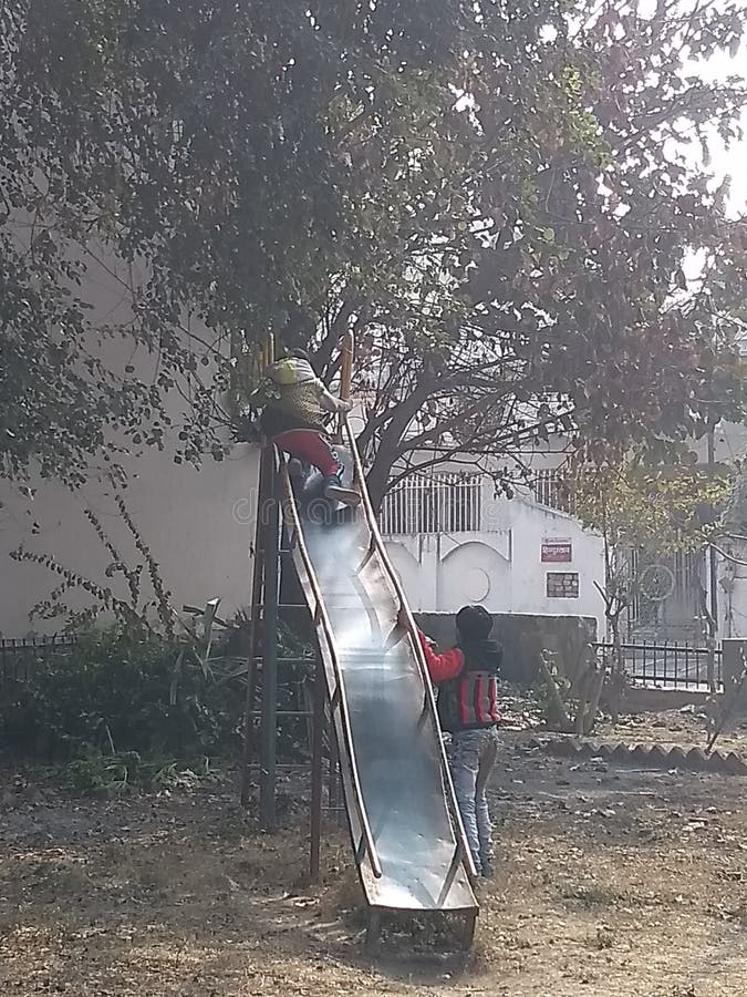 Kids on slide editorial stock photo. Image of slide - 107563023