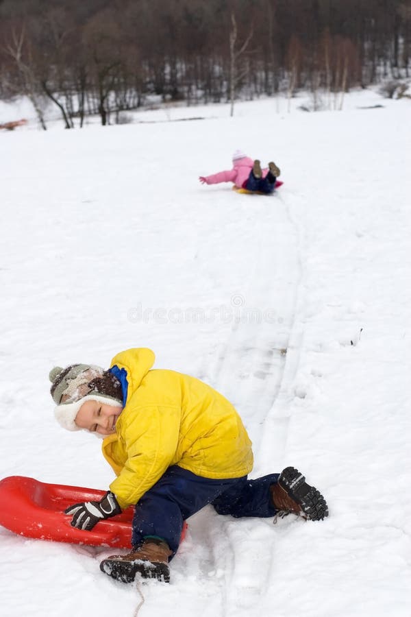 Kids Sliding in Fresh Snow stock photo. Image of enjoying - 1872068