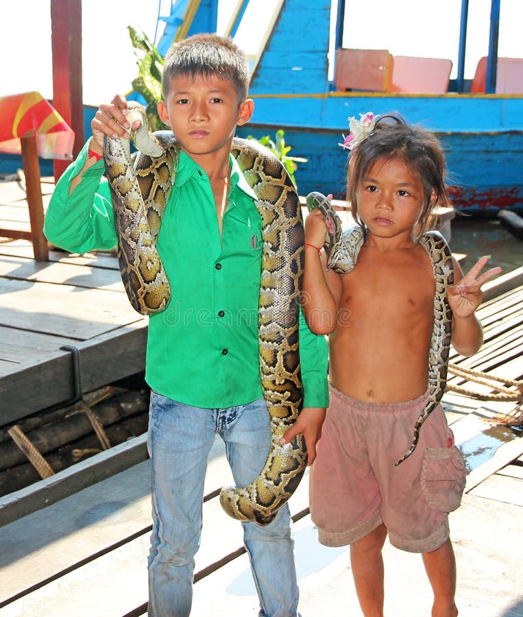 Kids with Snake editorial stock image. Image of money - 28321354
