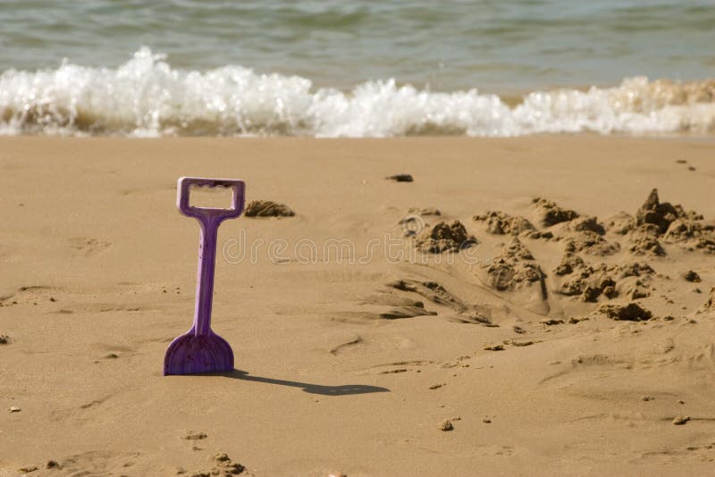 Kids Spade On The Sea Beach Stock Photo - Image of green, spade: 17835622