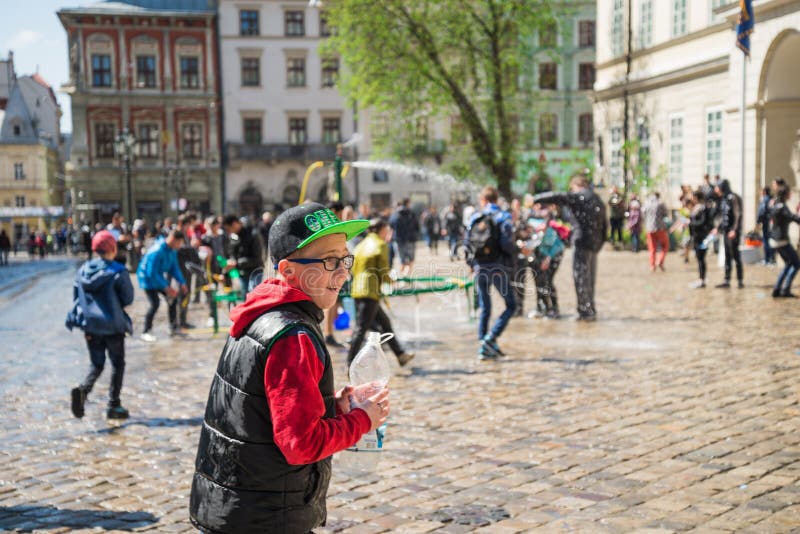 Kids Splash Each Other at Water Day Editorial Photo - Image of ...