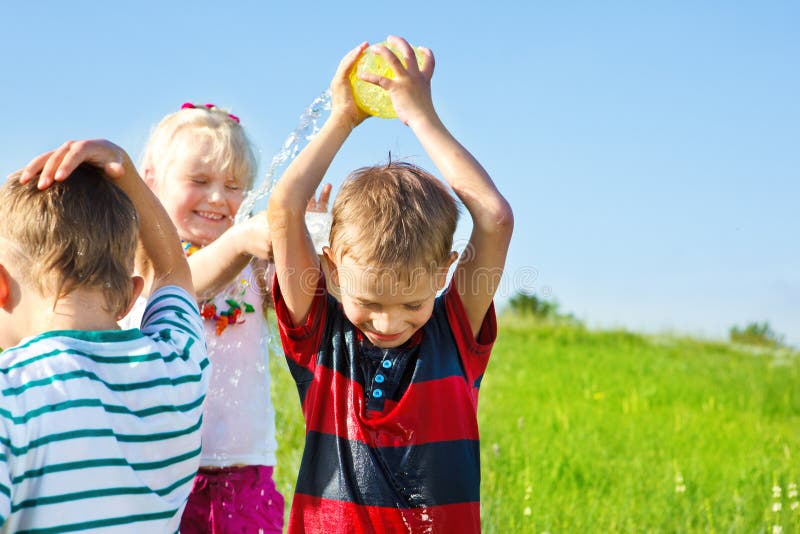 Kids spraying water stock image. Image of blaster, outdoors - 24769445