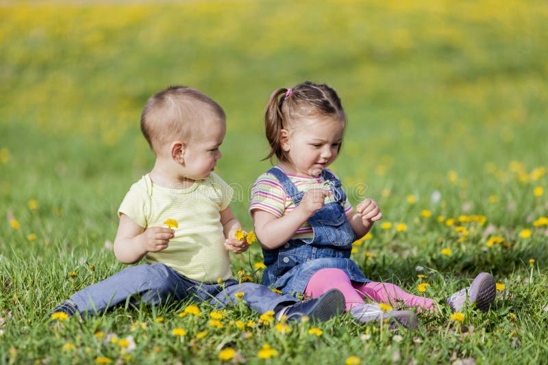 Kids in the spring field stock photo. Image of child - 30352616