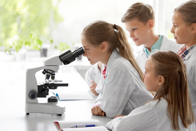 Kids or Students with Microscope Biology at School Stock Image - Image ...