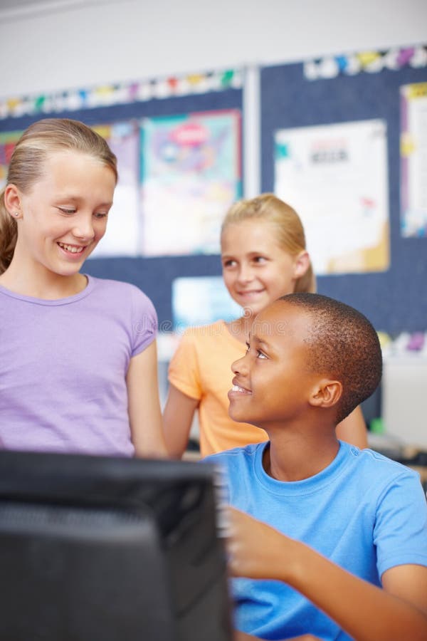 Kids, Students and Smile in Classroom on Computer with Group Work or ...