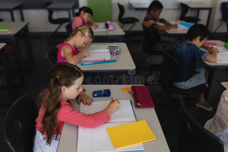 Kids studying in classroom stock photo. Image of girls - 137887116