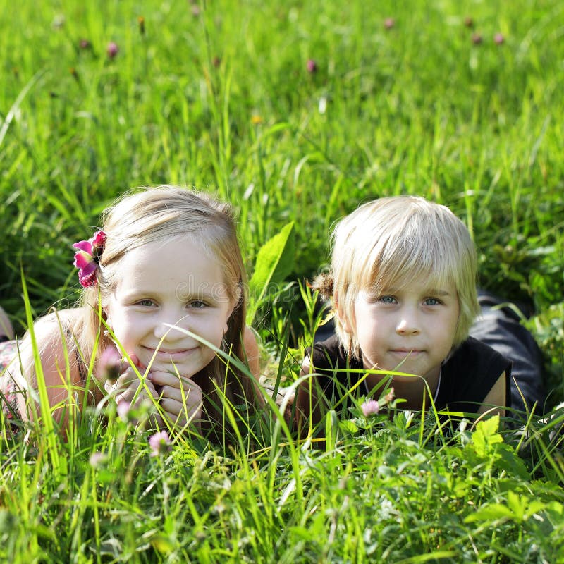 Kids on summer grass stock photo. Image of lifestyle - 39012584
