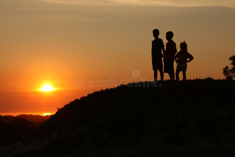 Kids at Sunset 2 stock image. Image of colors, evening - 7891259