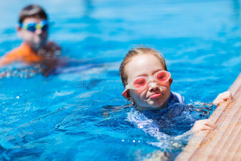 Kids in swimming pool stock image. Image of resort, expression - 60684767