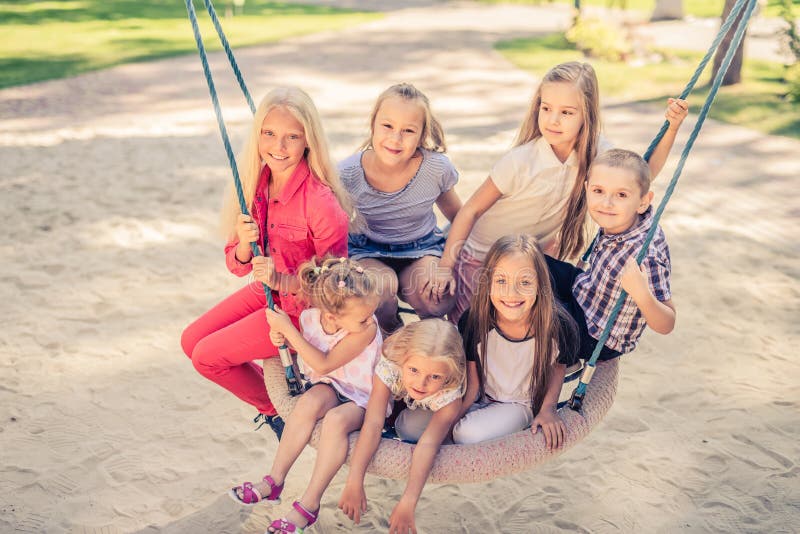 Kids on the Swing stock photo. Image of group, active - 174279088